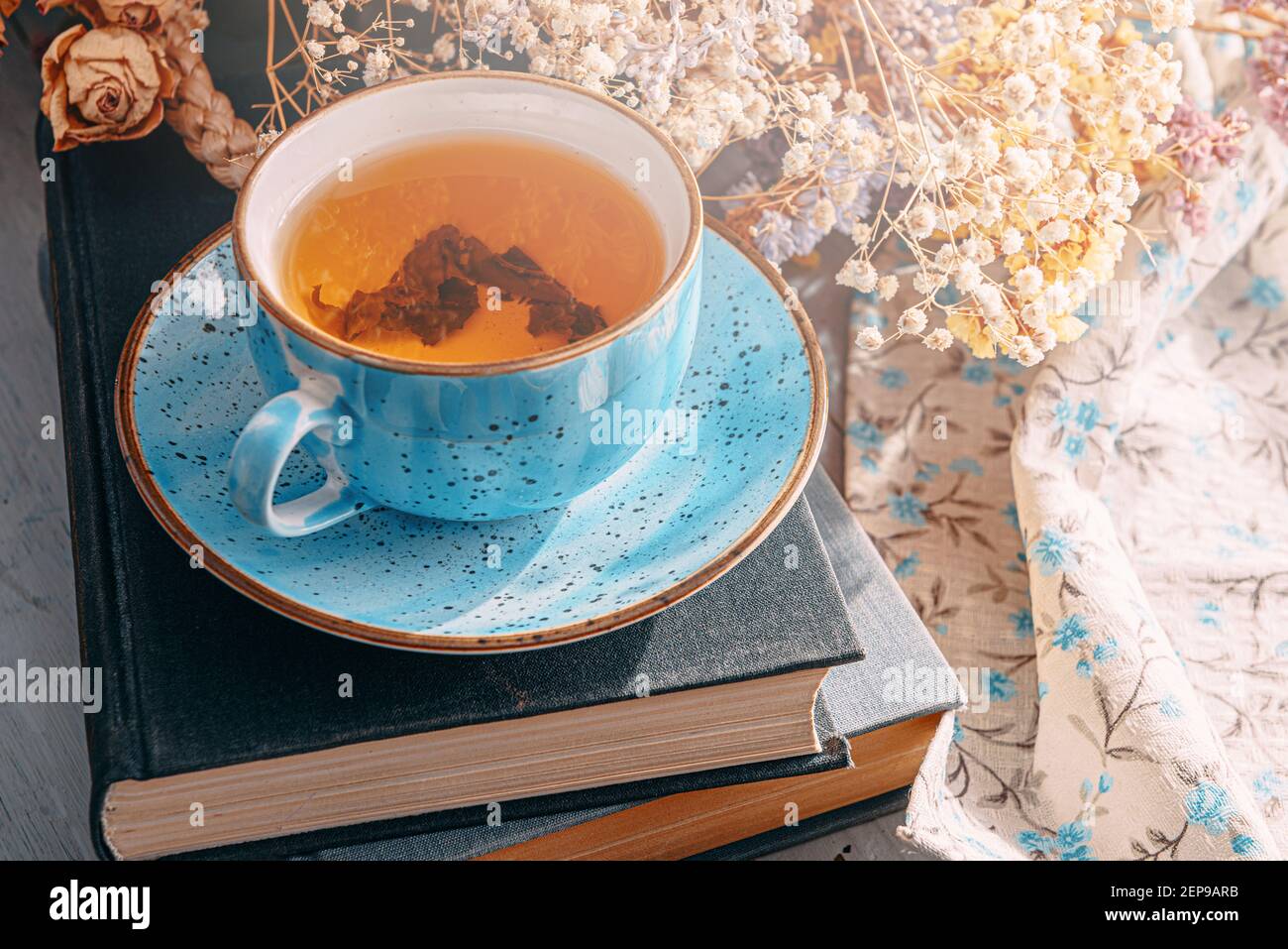 tea in a blue porcelain cup on a table in the sun Stock Photo - Alamy