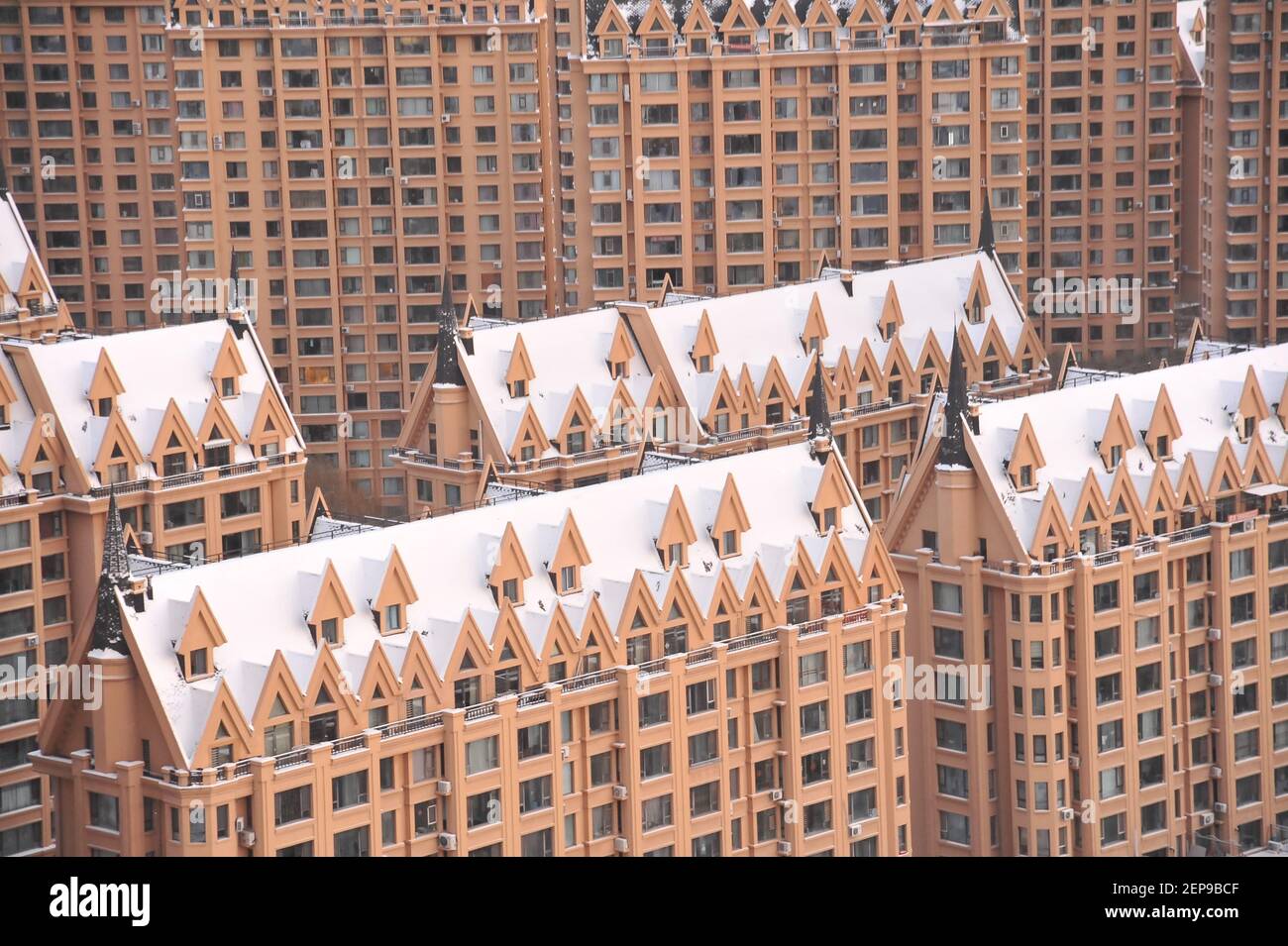 Buildings are covered with snow at the top after an overnight snowfall ...