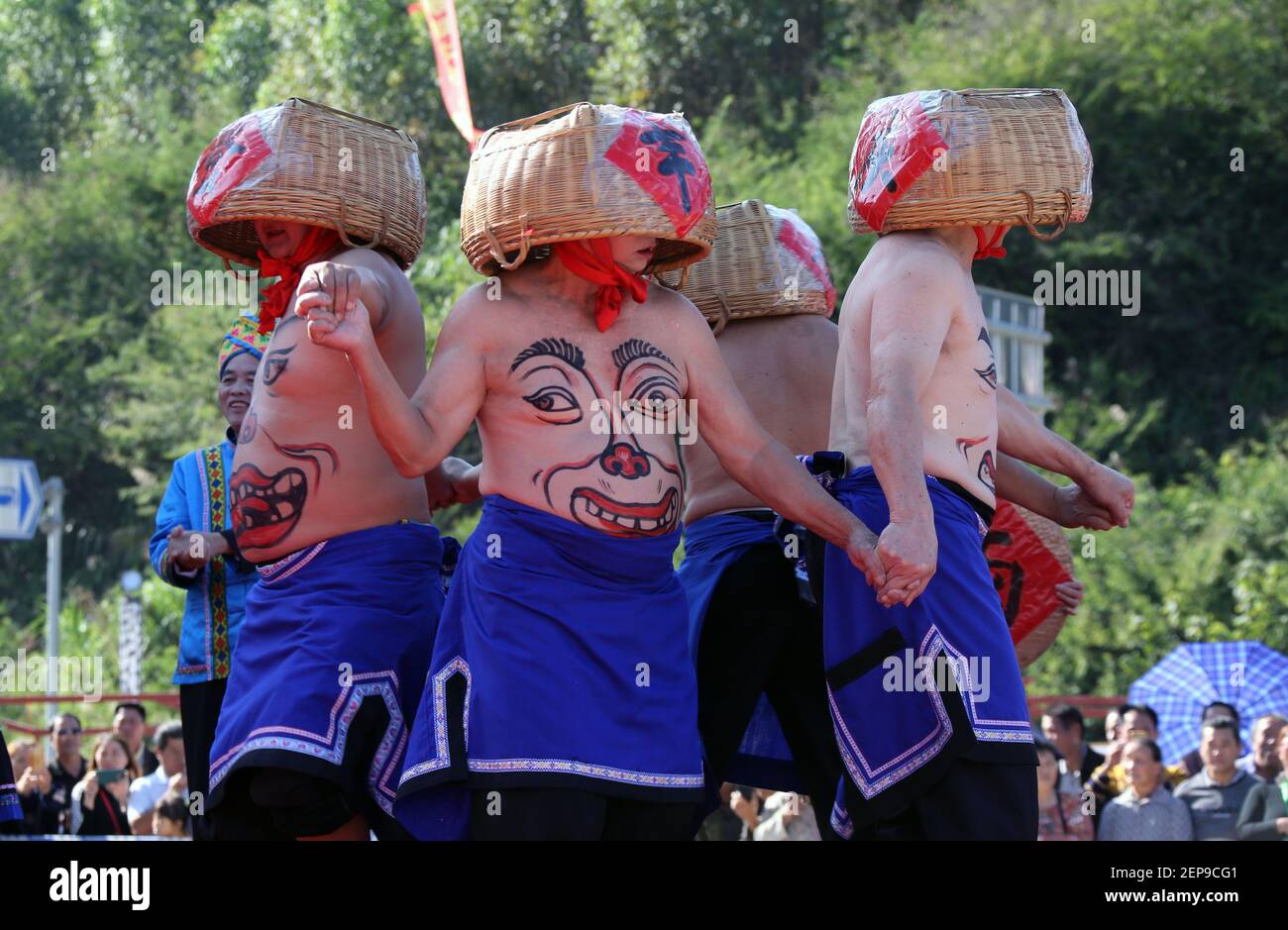 The Zhuang people are dancing traditional dwarf dance to celebrate the ...