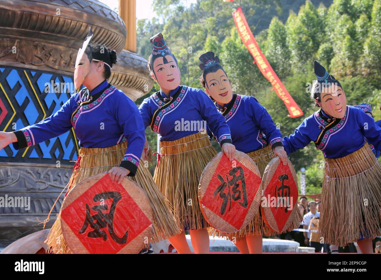 The Zhuang people are dancing traditional dwarf dance to celebrate the harvest in Jingxi,Guangxi ...