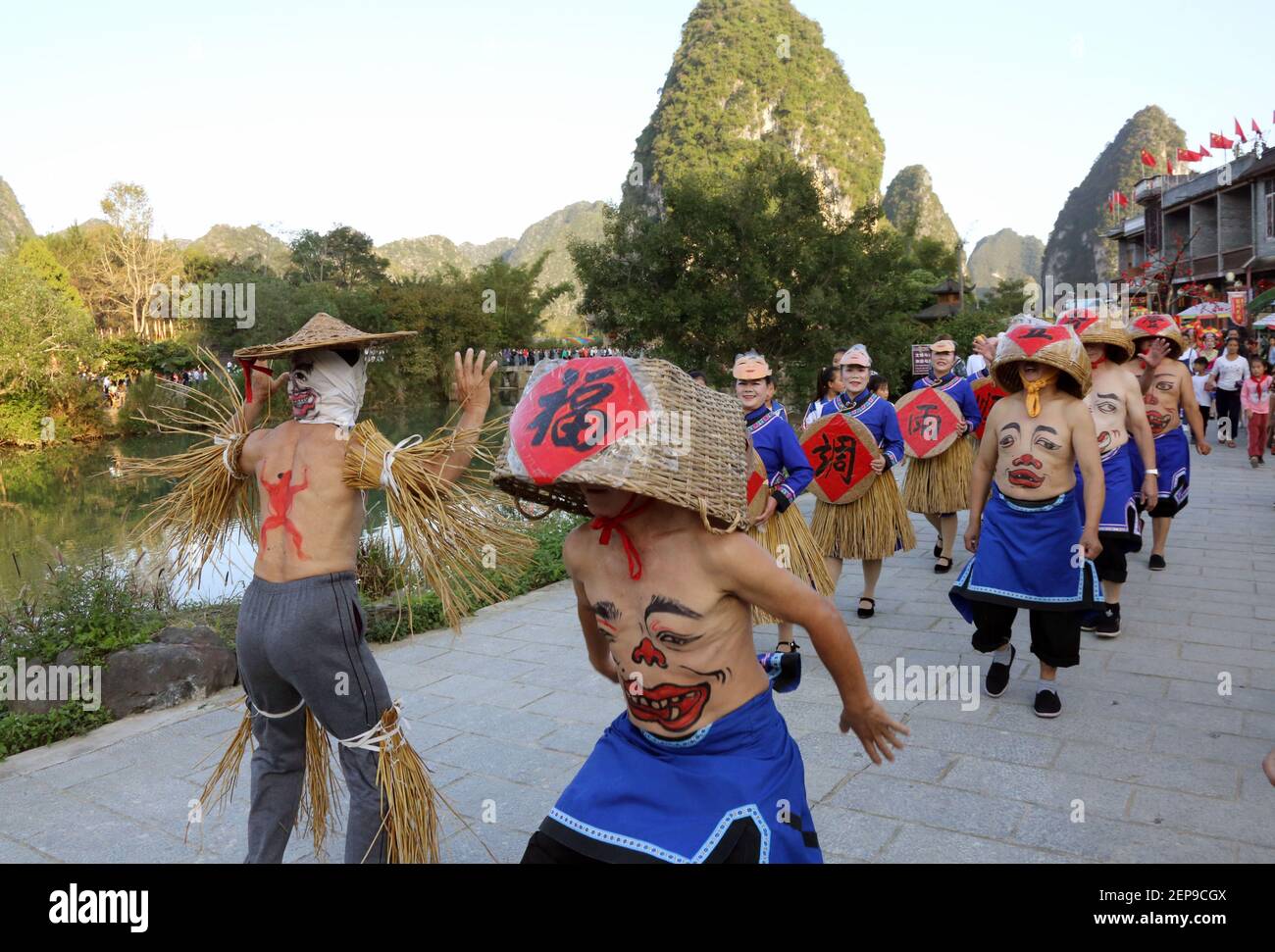 The Zhuang people are dancing traditional dwarf dance to celebrate the ...