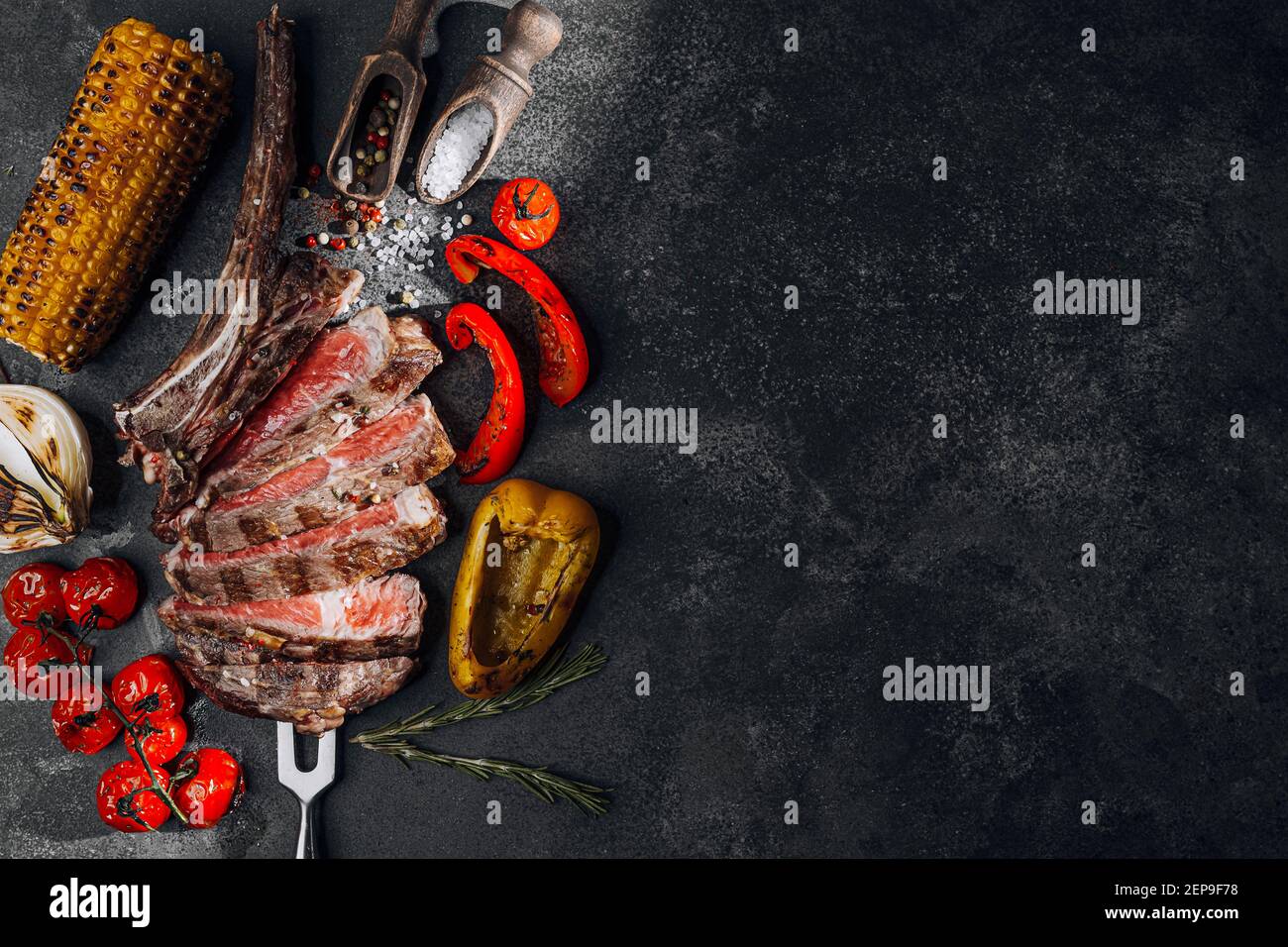 fresh grilled tomahawk steak with vegetables Stock Photo - Alamy