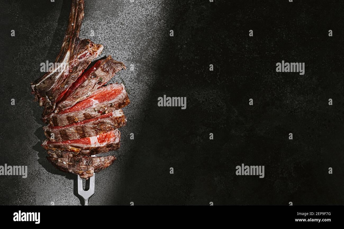 fresh grilled tomahawk steak with vegetables Stock Photo - Alamy