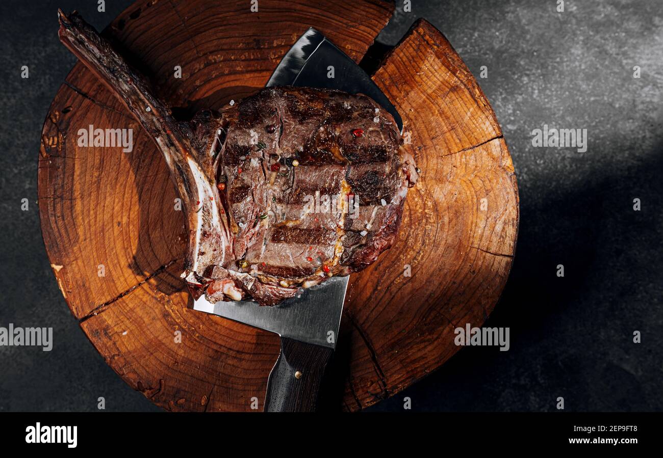 fresh grilled tomahawk steak with vegetables Stock Photo - Alamy