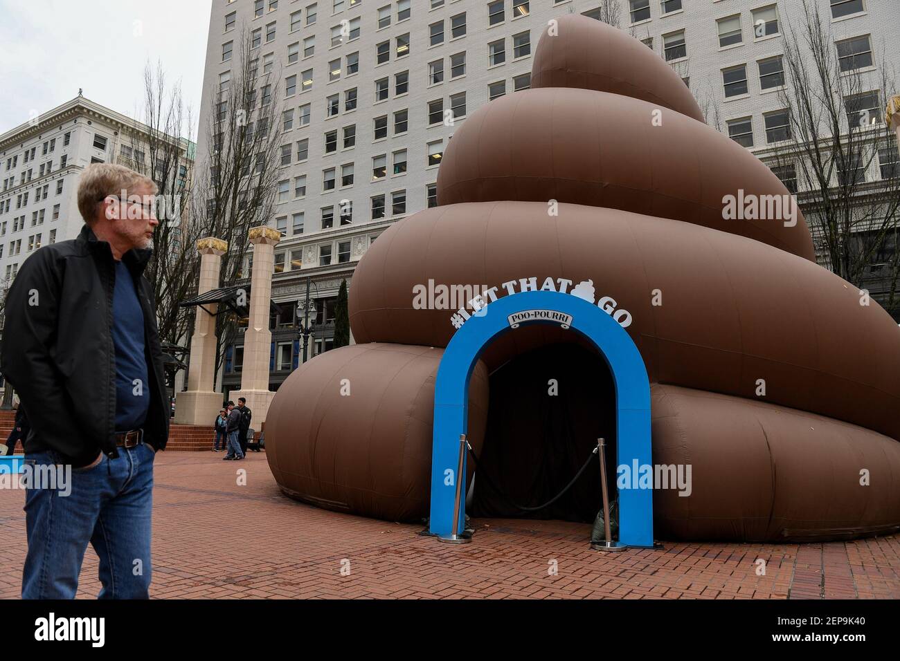 A giant inflatable poop emoji is currently in the middle of downtown ...