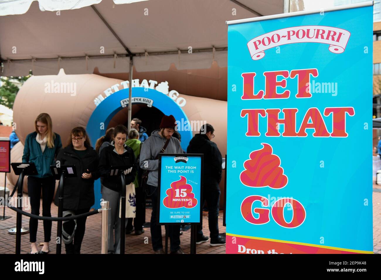 A giant inflatable poop emoji is currently in the middle of downtown ...