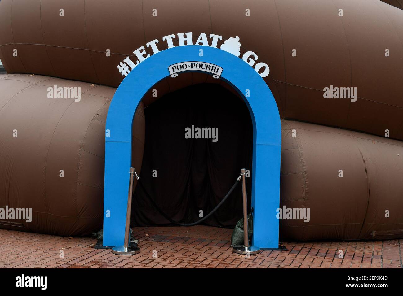 A giant inflatable poop emoji is currently in the middle of downtown ...