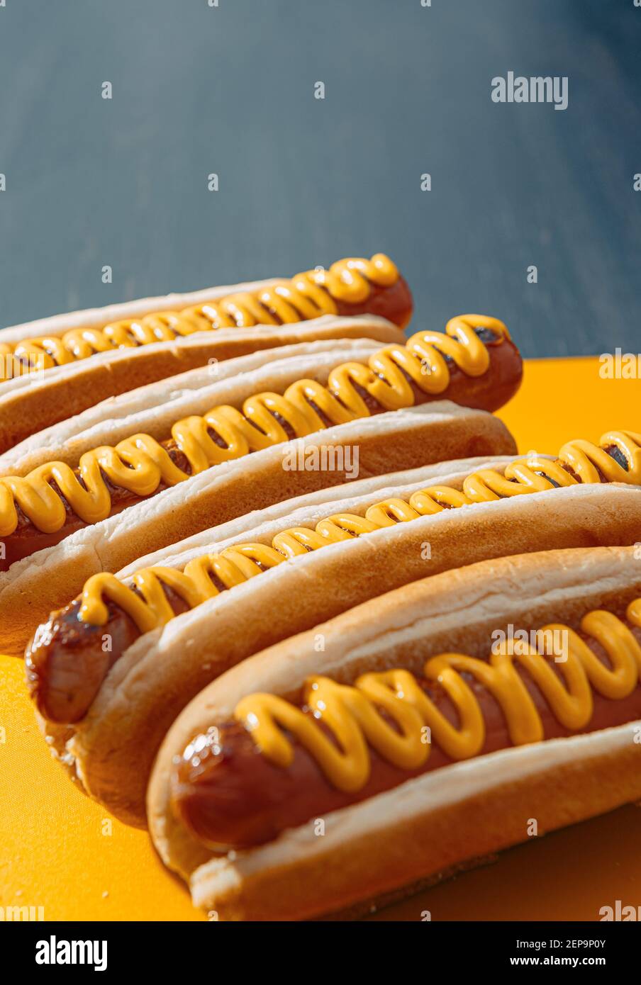 four fresh ready to eat american hot dogs Stock Photo - Alamy