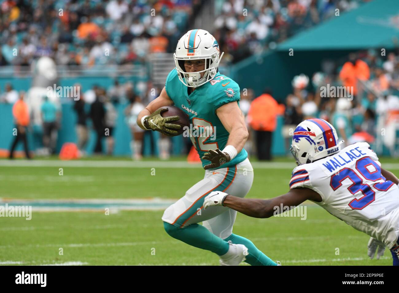 November 17, 2019: Patrick Laird #42 of Miami runs from Levi Wallace ...