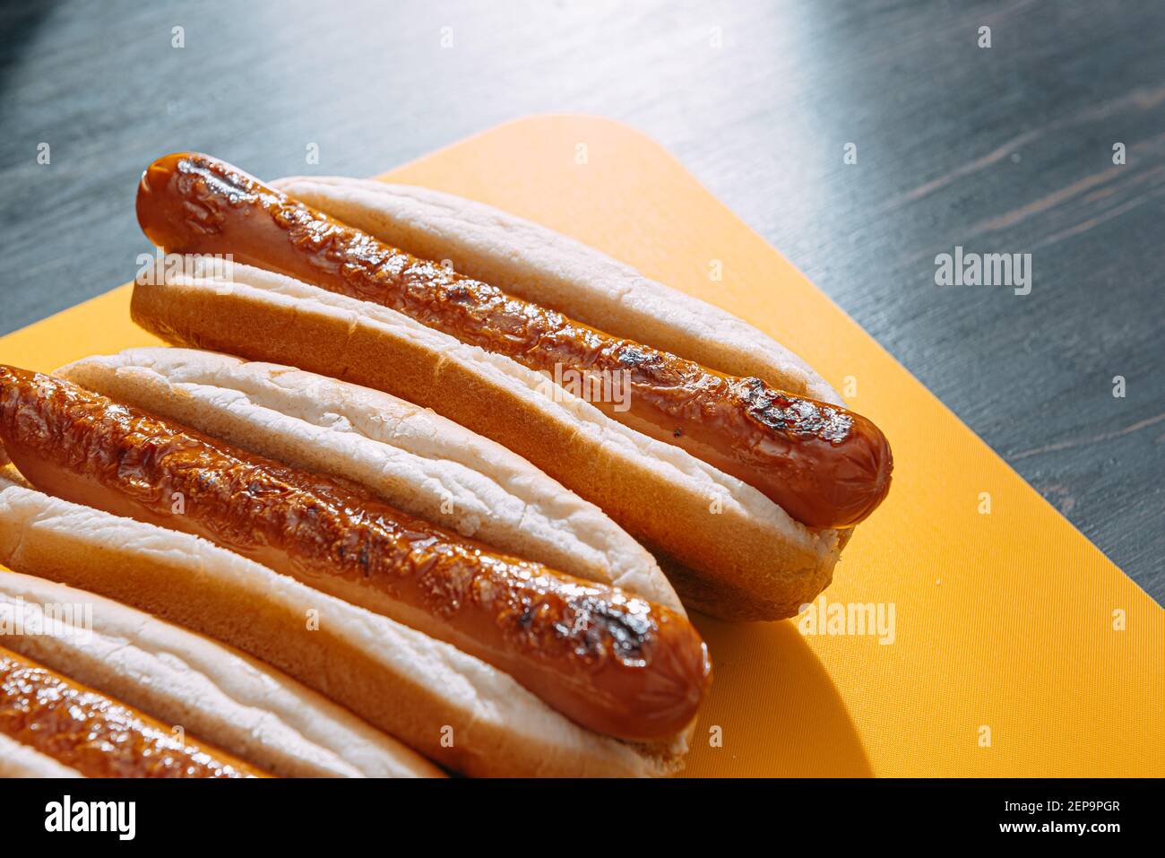 four fresh ready to eat american hot dogs Stock Photo - Alamy