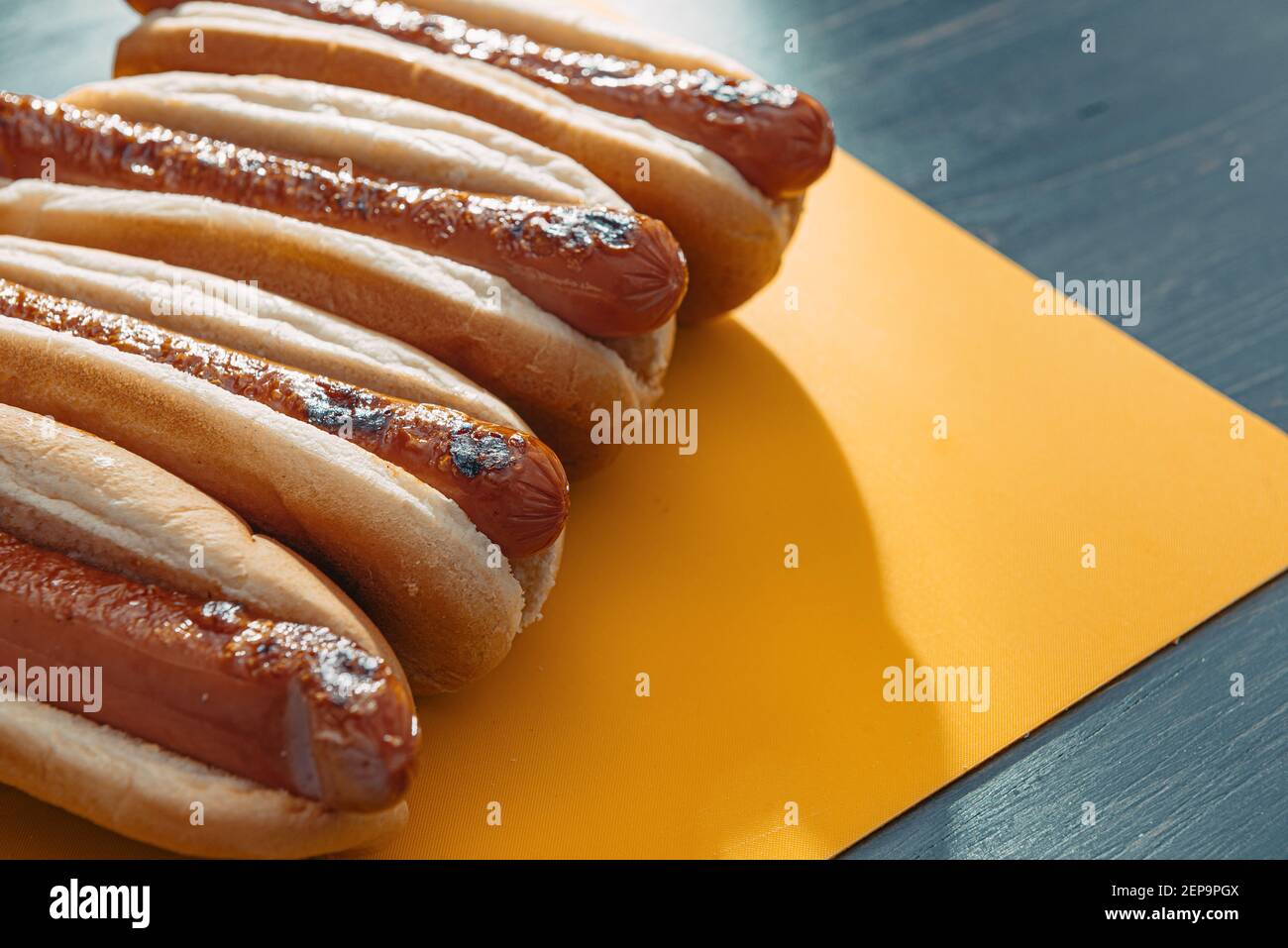 four fresh ready to eat american hot dogs Stock Photo - Alamy
