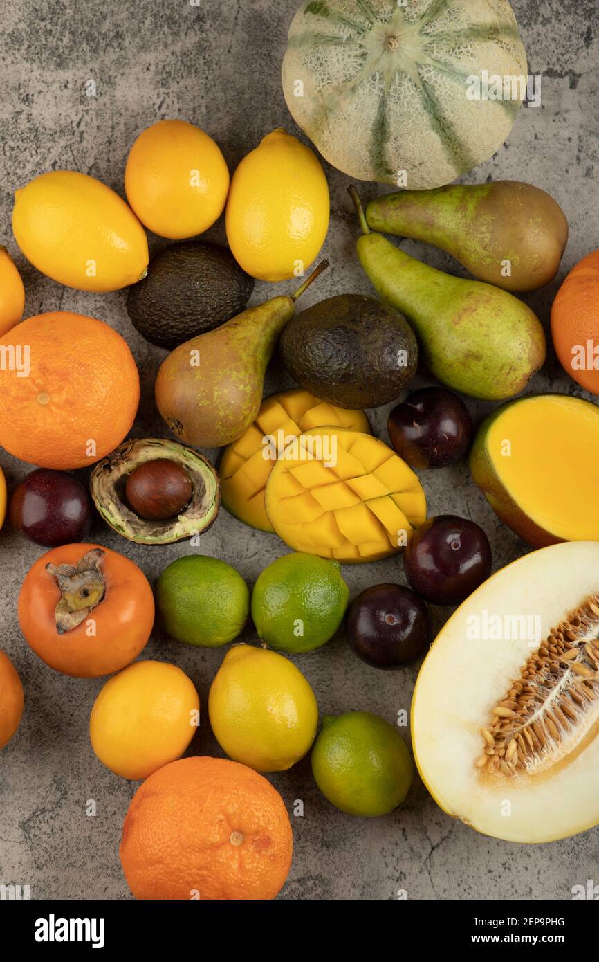Pile of fresh whole fruit composition on marble surface Stock Photo - Alamy