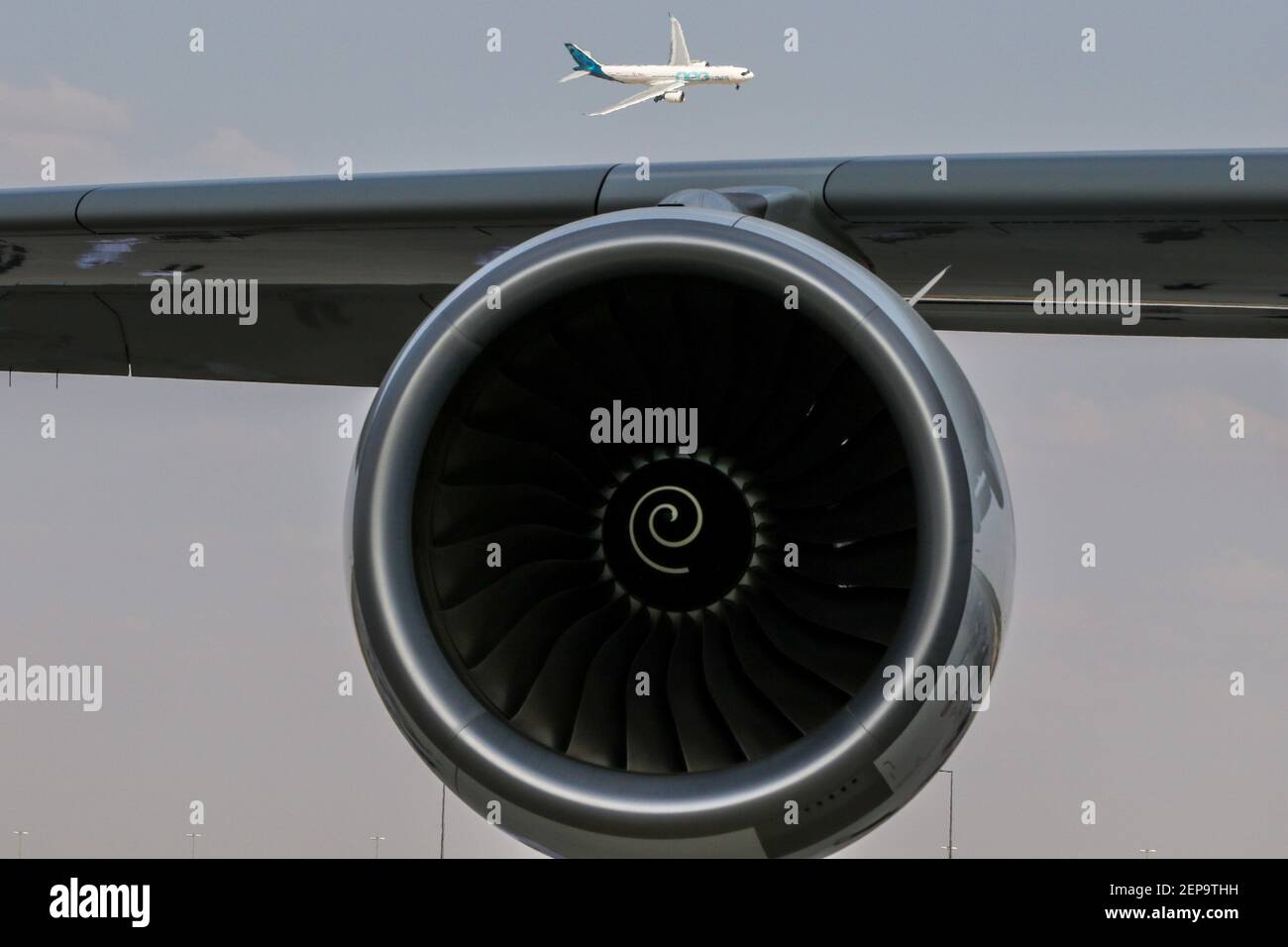 The Airbus A330 neo widebody jetliner flies with a jet engine on the ...