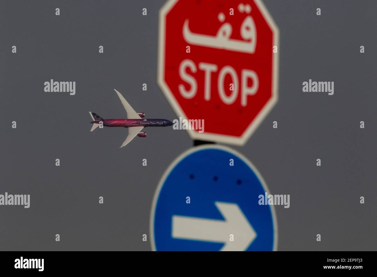 The Boeing 787-9 civil jetliner flies behind a STOP sign while ...