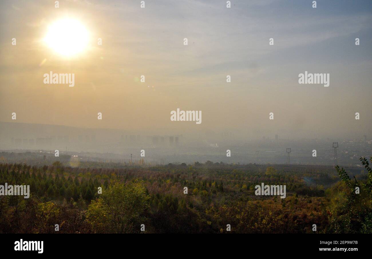 A distant view of the skyscrapers covered by heavy haze in downtown ...