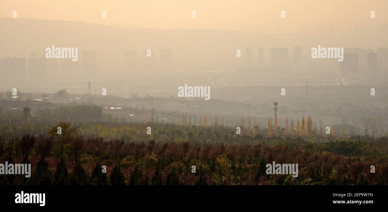 A distant view of the skyscrapers covered by heavy haze in downtown ...