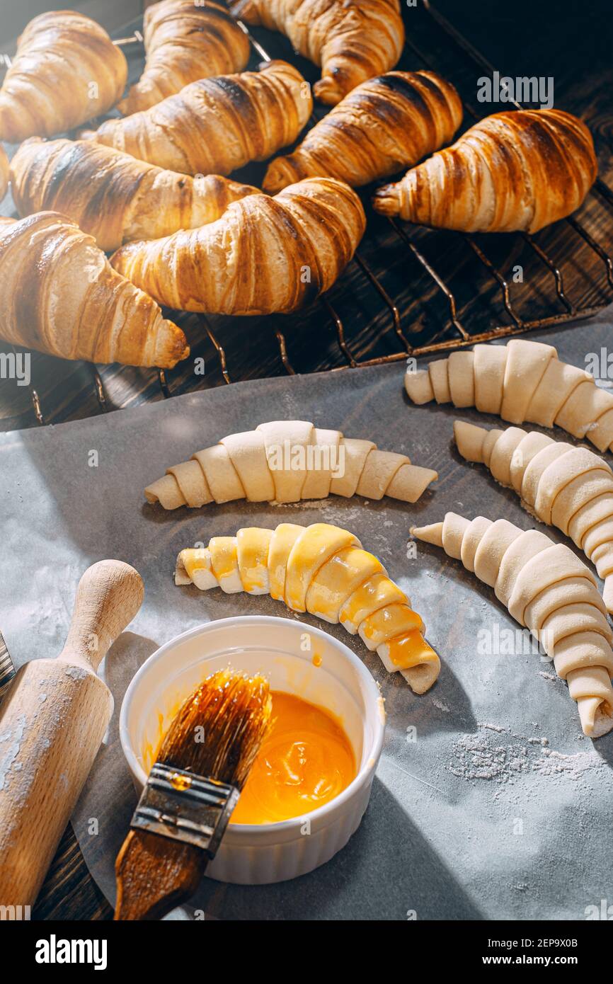 the chef cooks croissants in the kitchen in the morning, on the table ...