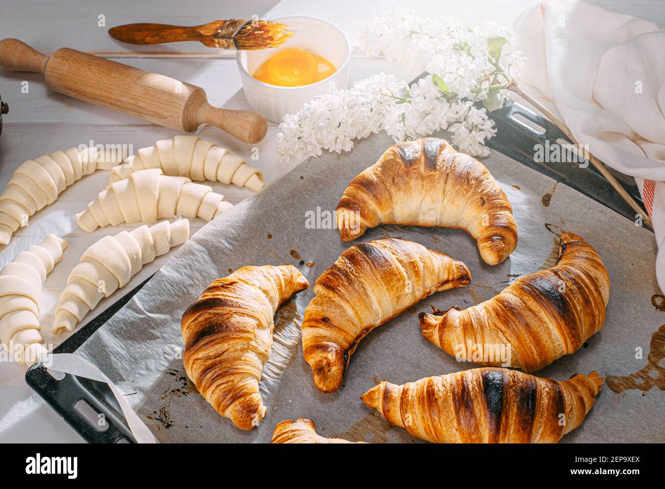 the chef cooks croissants in the kitchen in the morning, on the table ...
