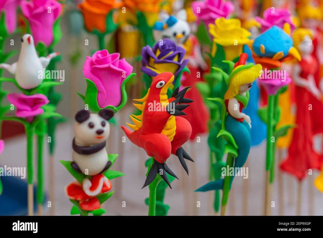 Street art - close up photo of colorful Chinese dough sculpture figures ...
