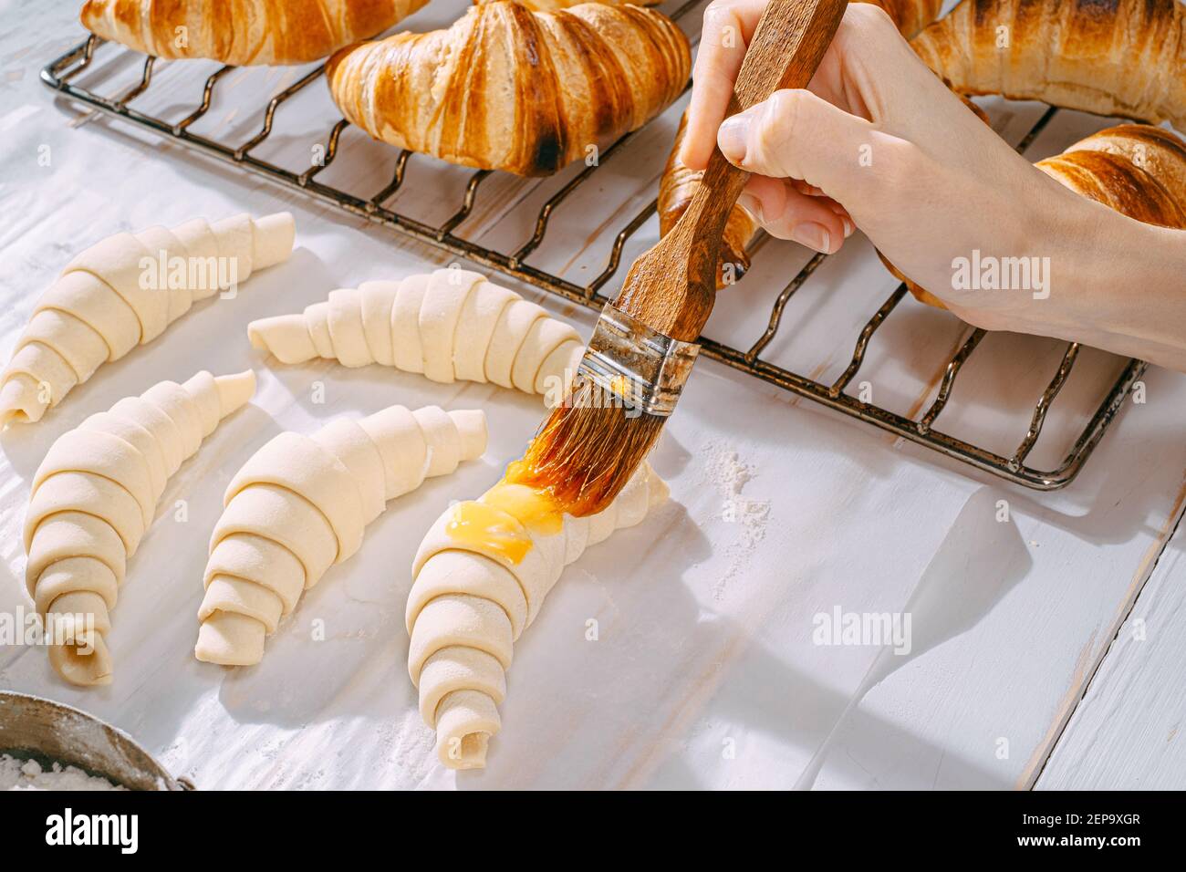 the chef cooks croissants in the kitchen in the morning, on the table ...