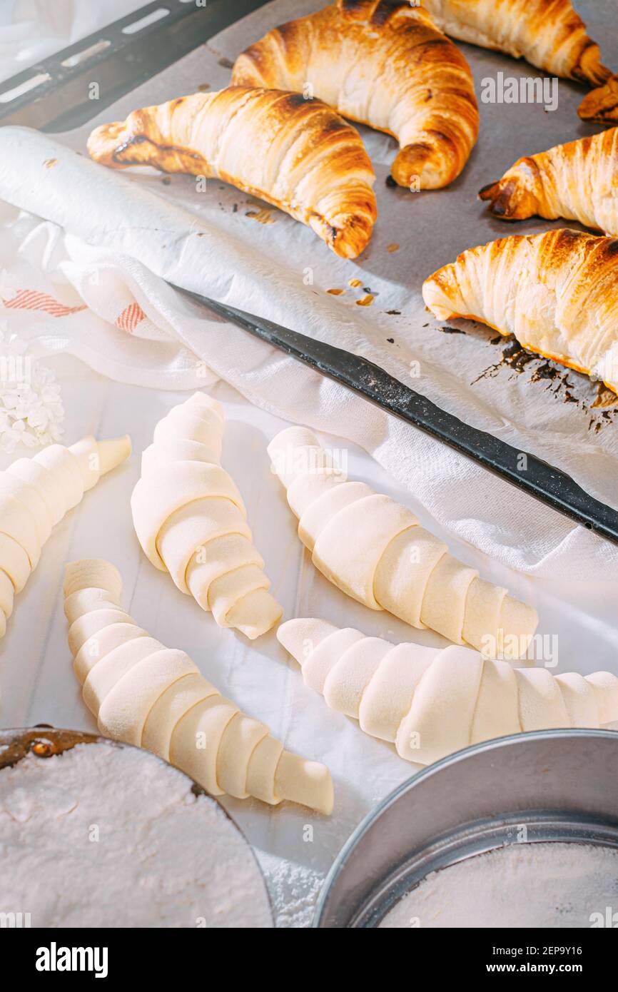 the chef cooks croissants in the kitchen in the morning, on the table ...