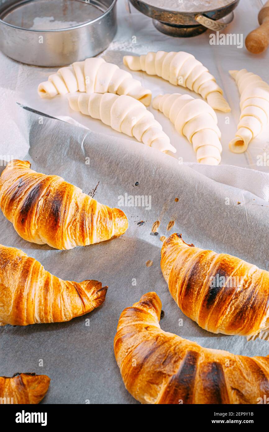 the chef cooks croissants in the kitchen in the morning, on the table ...