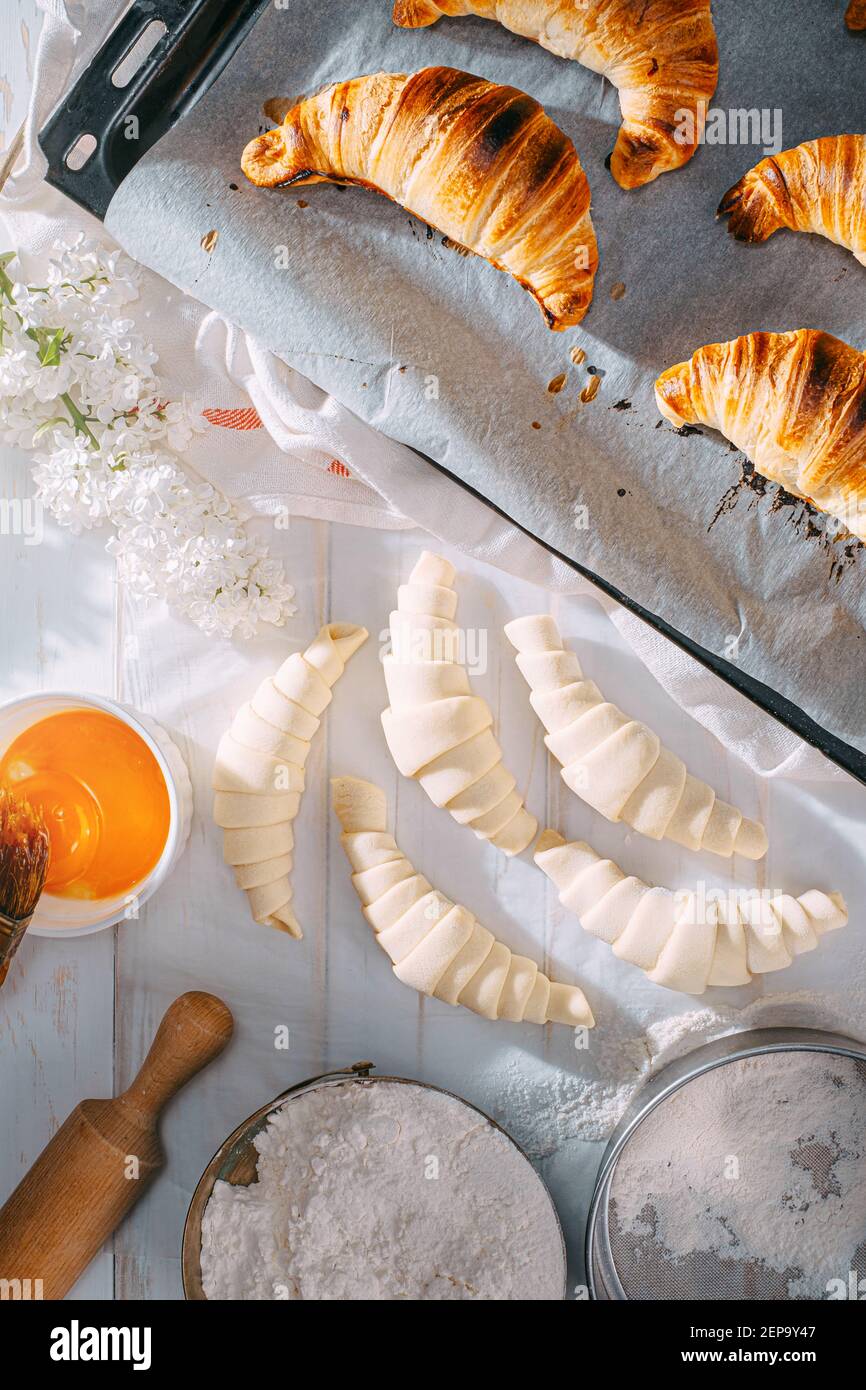 the chef cooks croissants in the kitchen in the morning, on the table ...