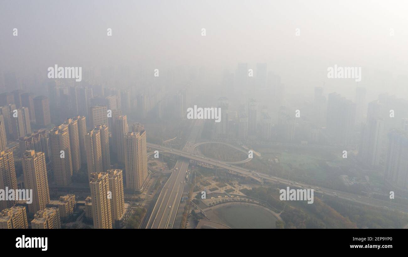 Aerial view of the skyscrapers covered by heavy haze in downtown area ...
