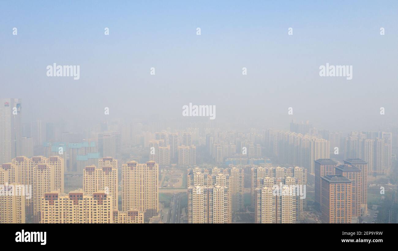 Aerial view of the skyscrapers covered by heavy haze in downtown area ...