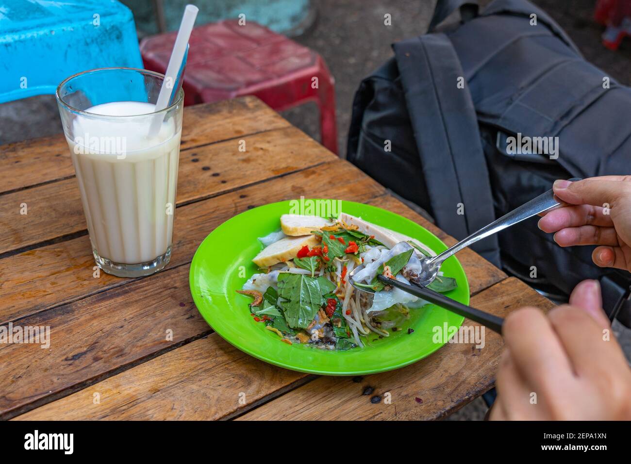 Human eating Vietnam steamed rice rolls with chili dipping sauce Stock ...
