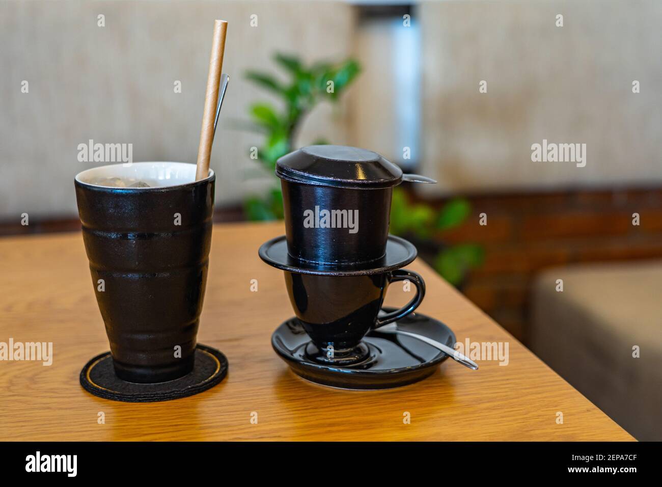 Traditional Vietnamese milk coffee brewed with dripping filter Stock ...