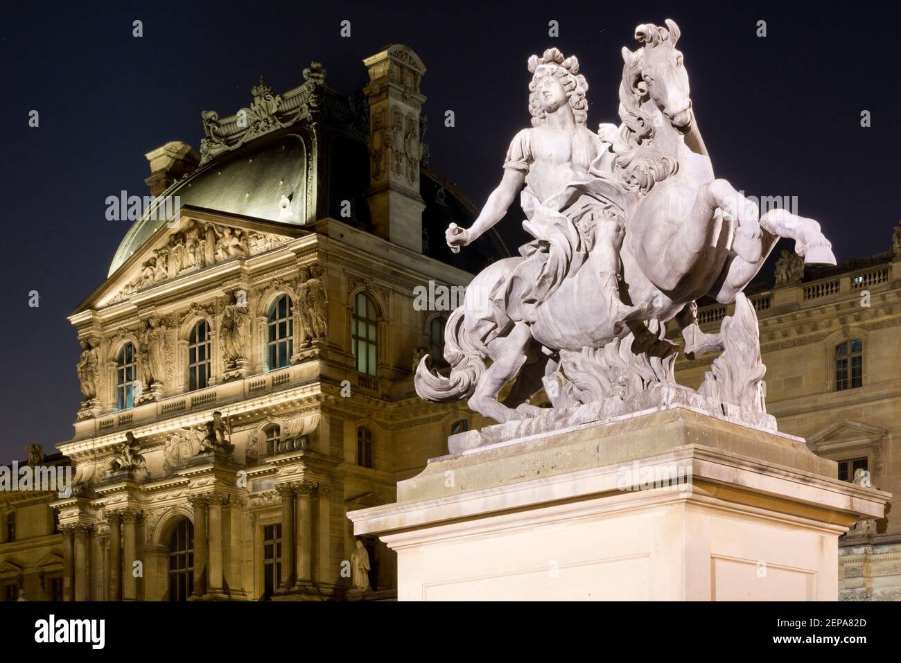 A statue of Louis XIV at the Louvre Museum, Paris, France Stock Photo ...