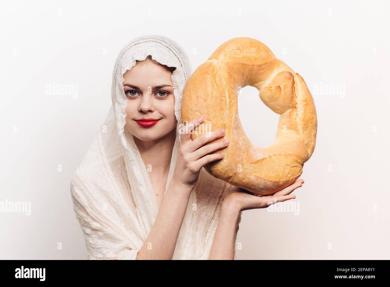 woman with round loaf of bread loaf model with transparent cloth on her ...