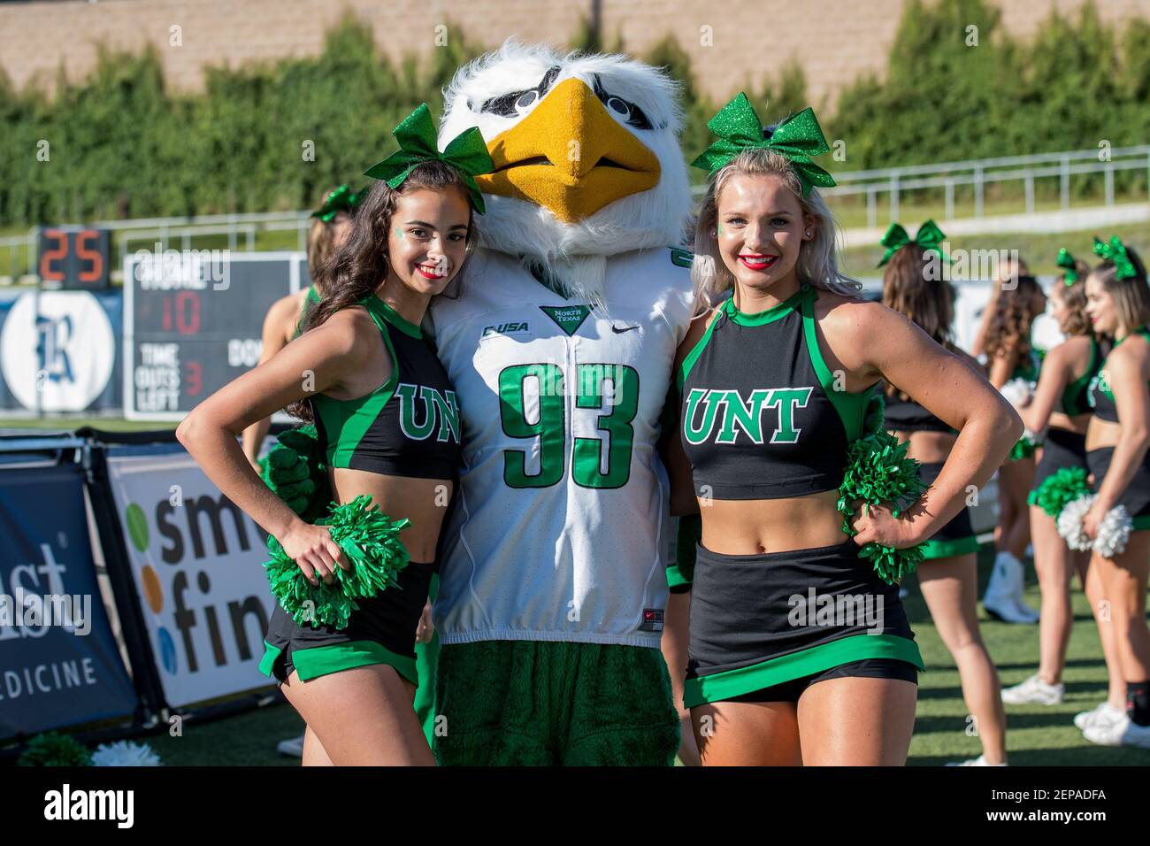 November 23, 2019: North Texas Mean Green cheerleaders pose with mascot ...