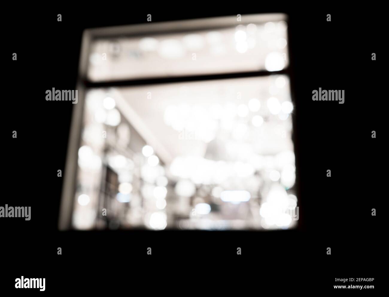 Abstract blurred windows with light bokeh at night. Defocused bokeh ...