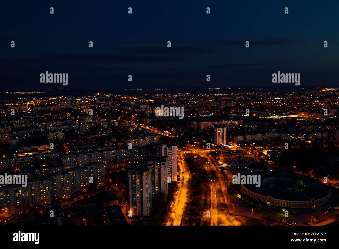 City night aerial view. Cityscape with living houses and commercial ...