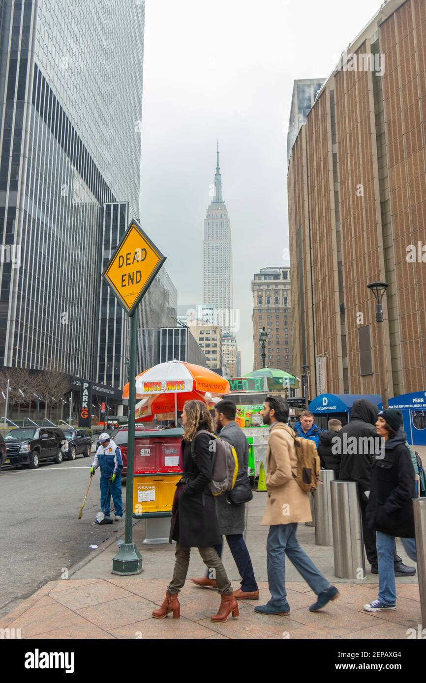 street scene in New York with Dead End sign and Empire State Building ...