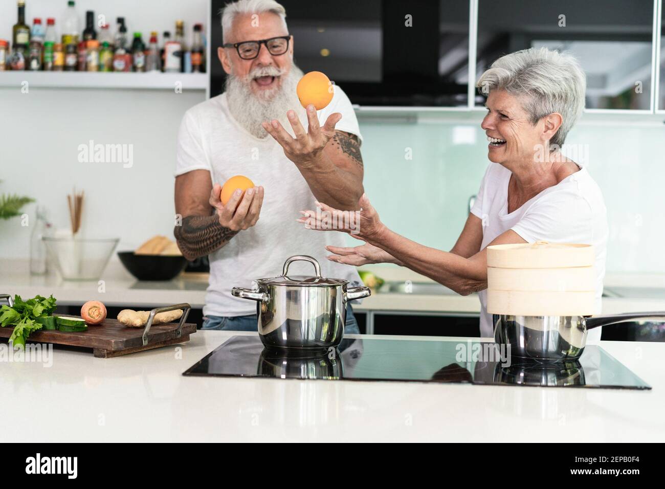 Mature woman cooking face on hi-res stock photography and images - Alamy