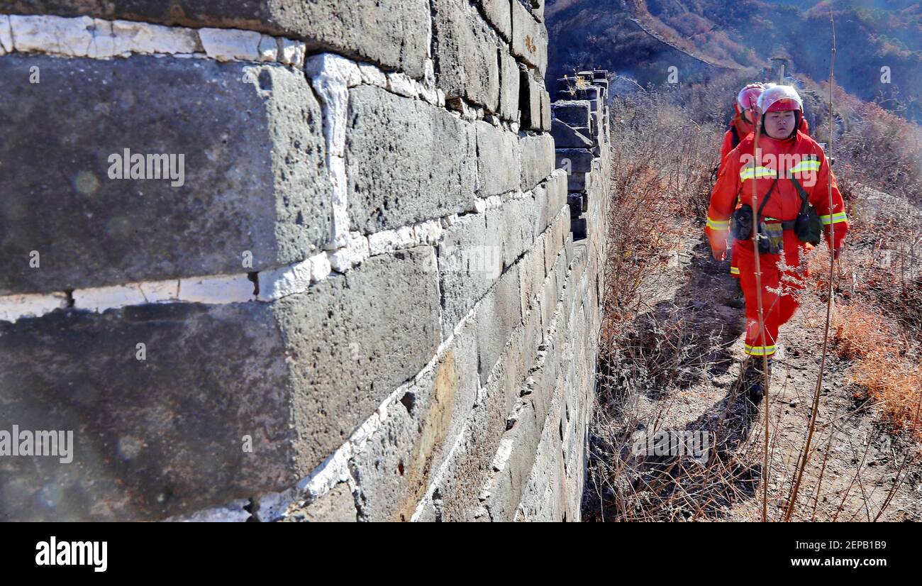 Chinese firefighters from the local forest firefighting brigade patrol ...