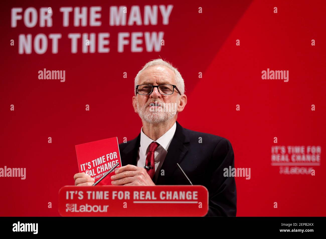 Leader of Labour Party, Jeremy Corbyn holding a copy of the Labour ...