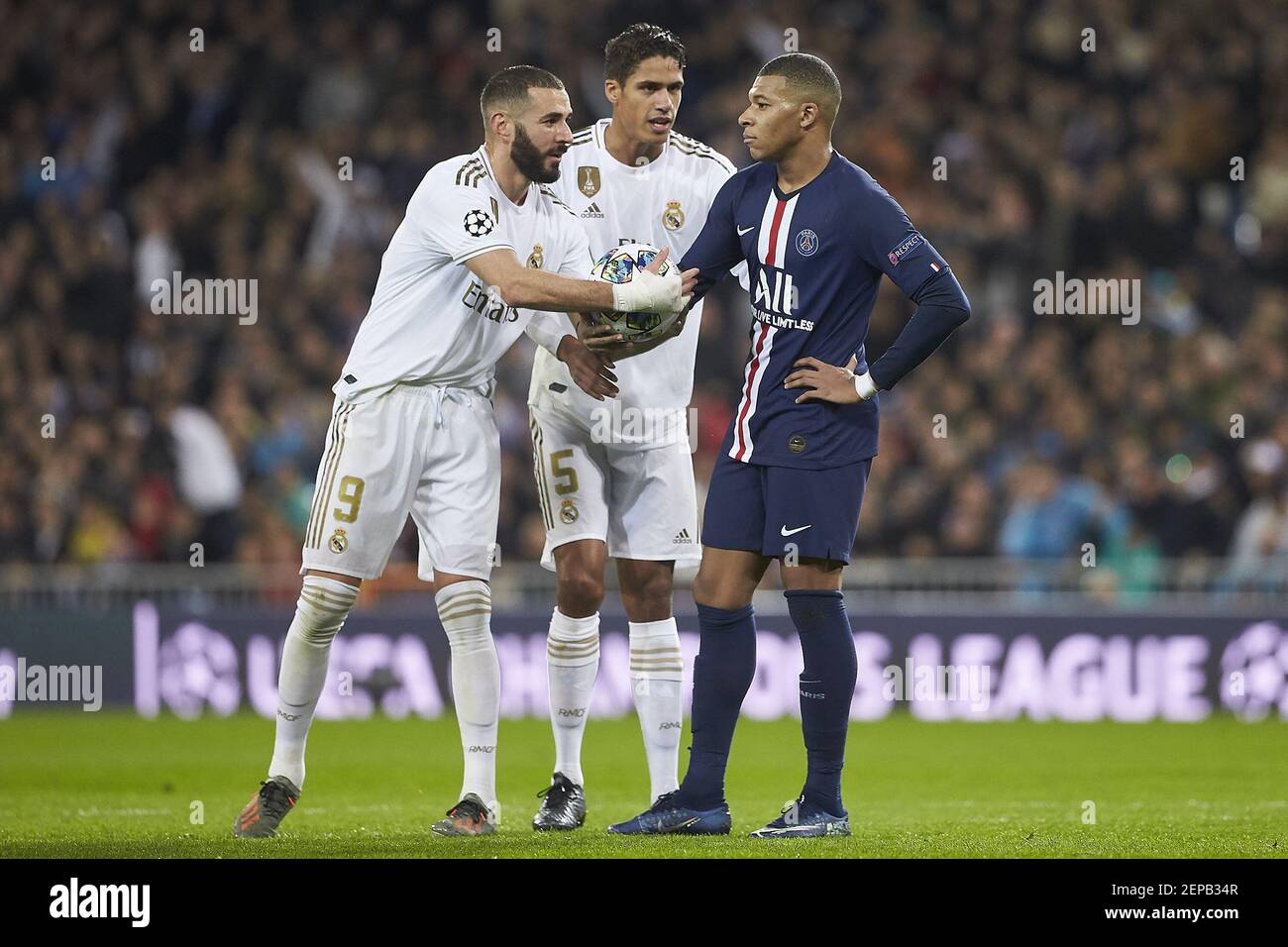 Kylian Mbappe of PSG and Karim Benzema and Raphael Varane of Real ...