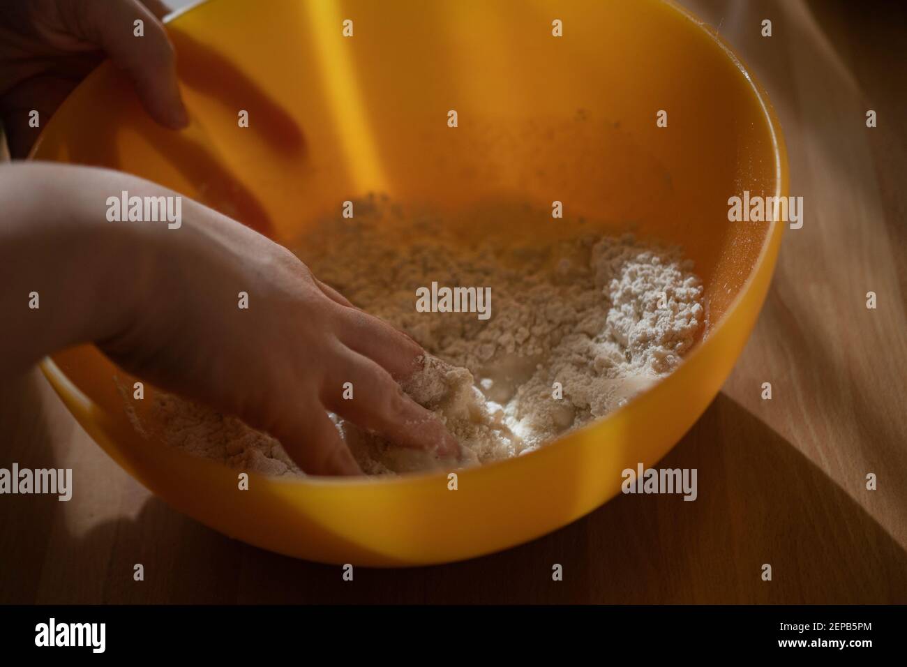 Woman mixing flour and water to make a dough Stock Photo - Alamy