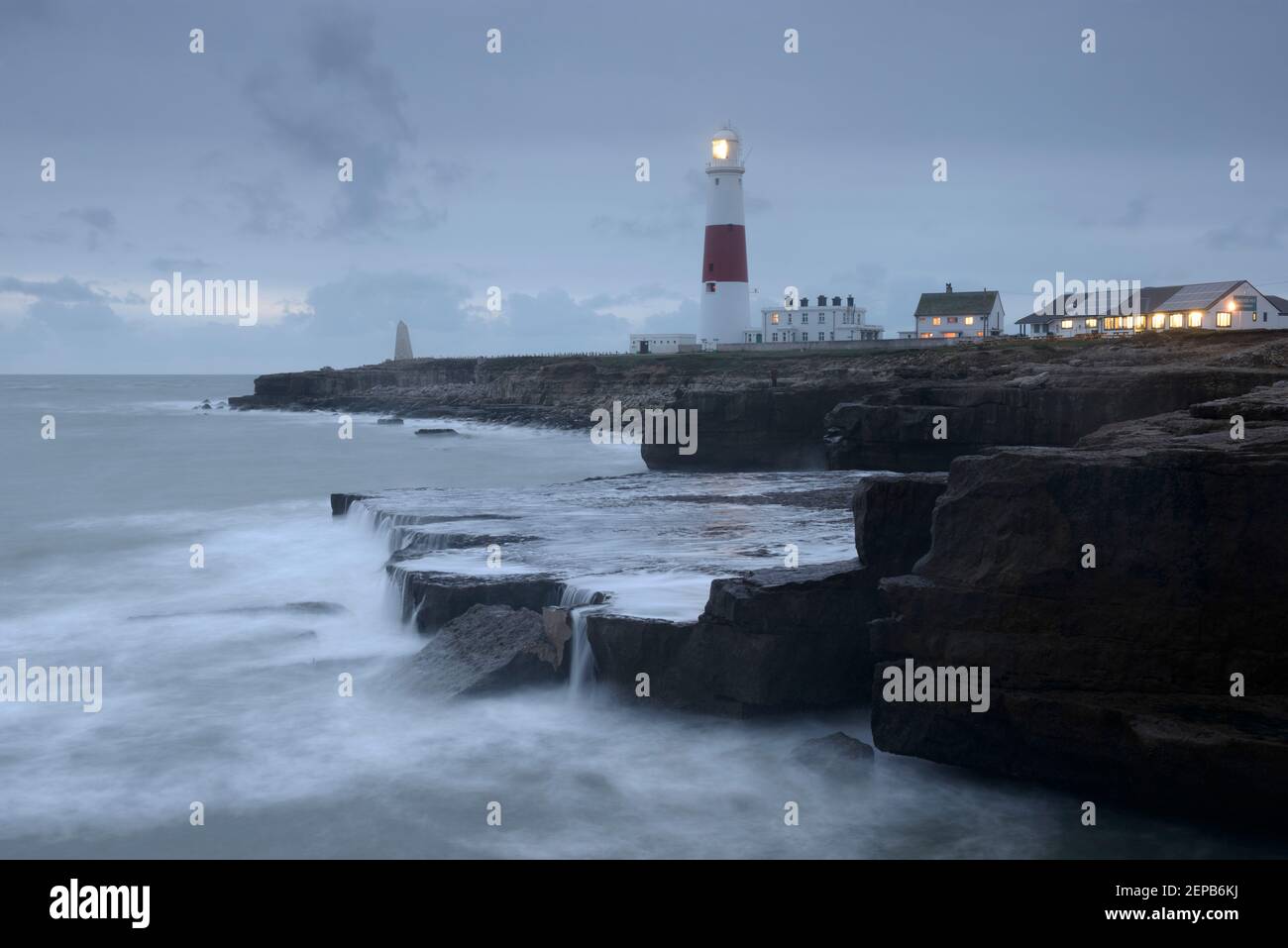 Portland Bill Lighthouse, Dorset, alight on a stormy evening Stock ...