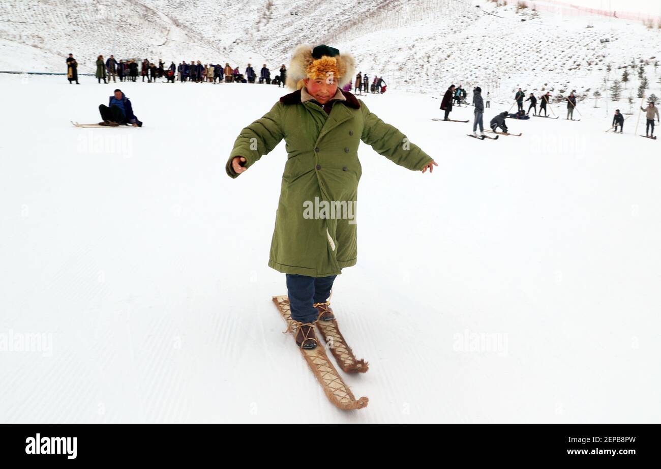 People take part in a carnival at a skiing field on Jiangjun Mountain ...