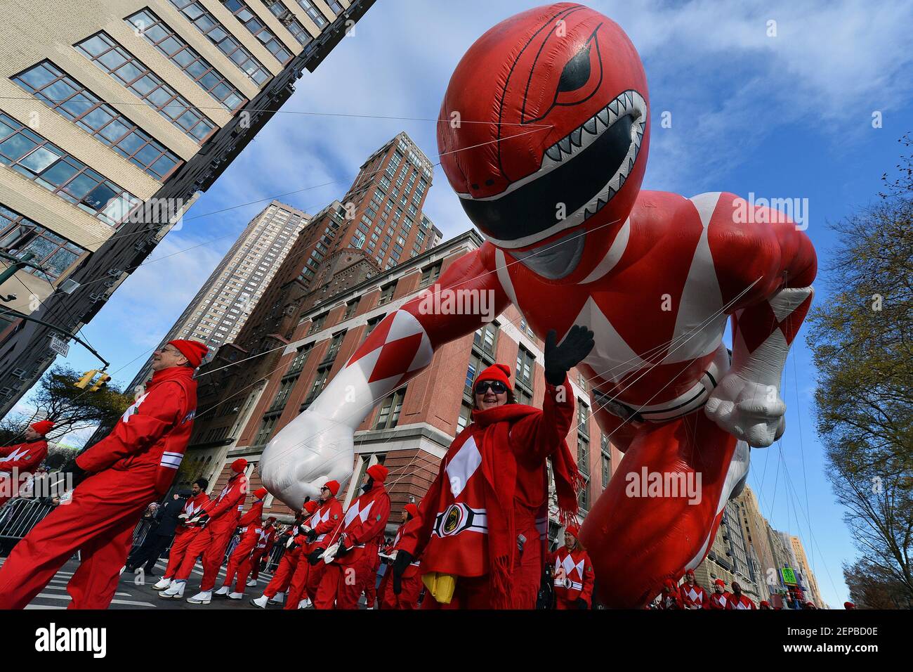 Red Power Ranger balloon is held low due to strong winds as he makes ...