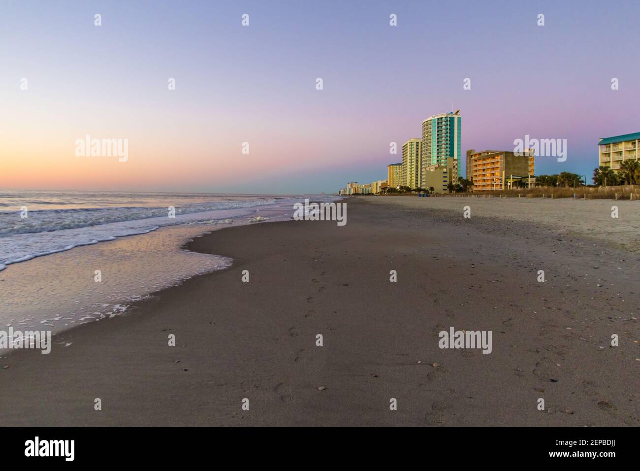 Myrtle Beach city skyline at dawn on the wide sandy beach of the ...