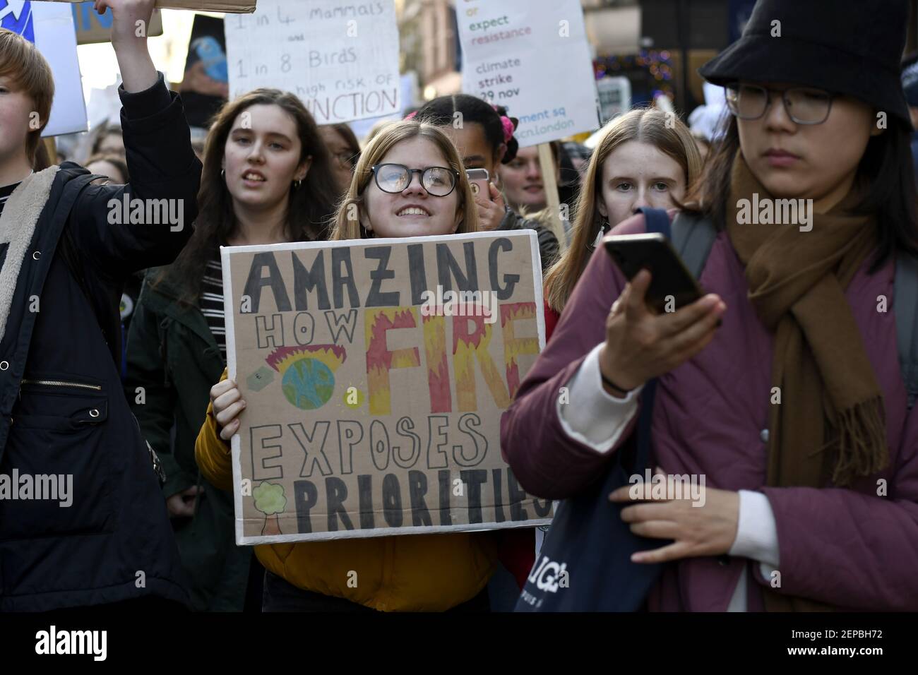 Environmental protester holding a placard during the strike. Children ...