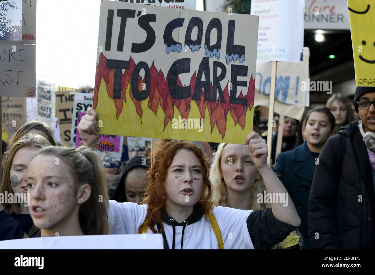Environmental protester holding a placard during the strike. Children ...