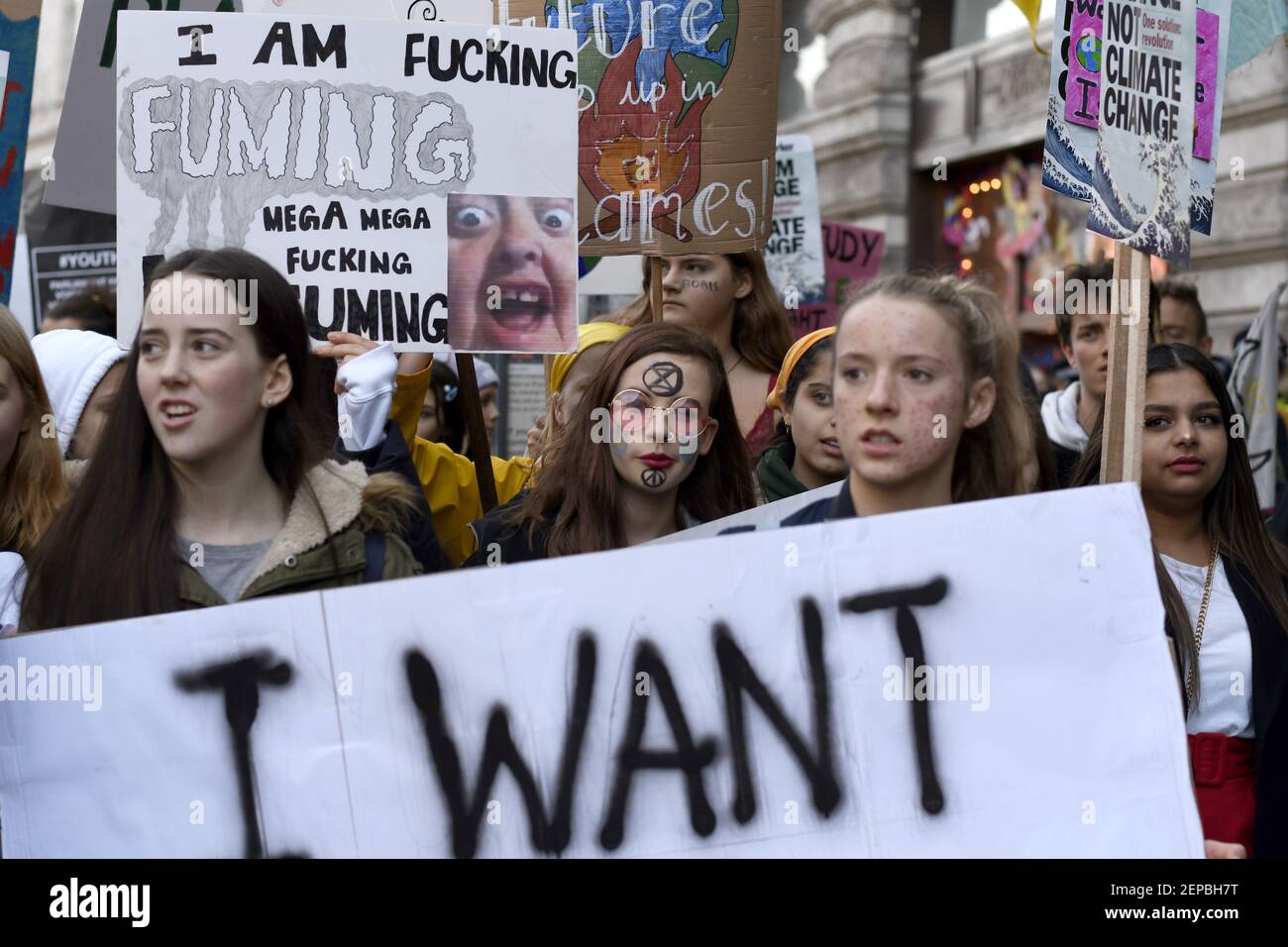 Environmental protesters shouting slogans during the strike. Children ...