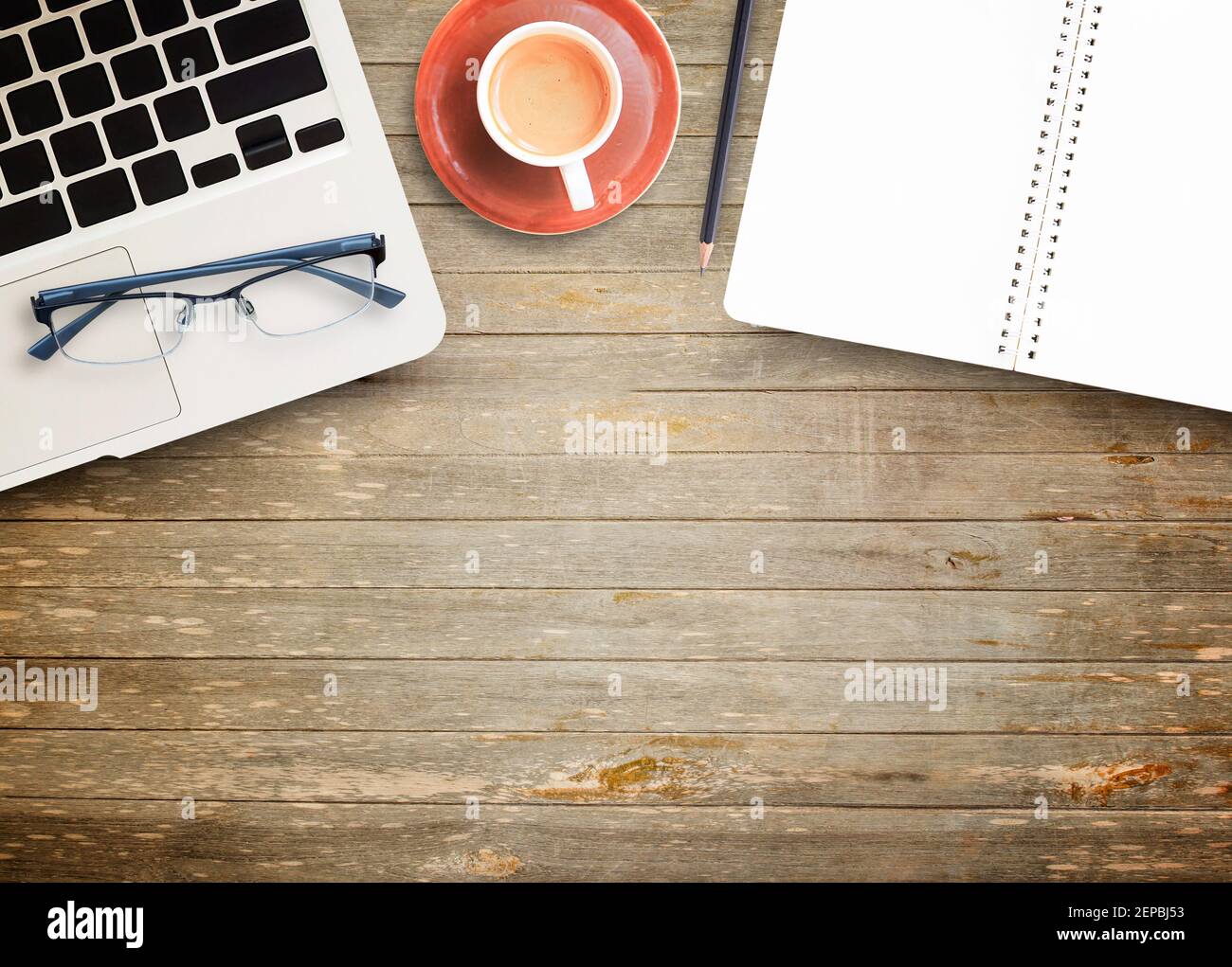Top view office desk. notebook and laptop computer glasses on wood ...